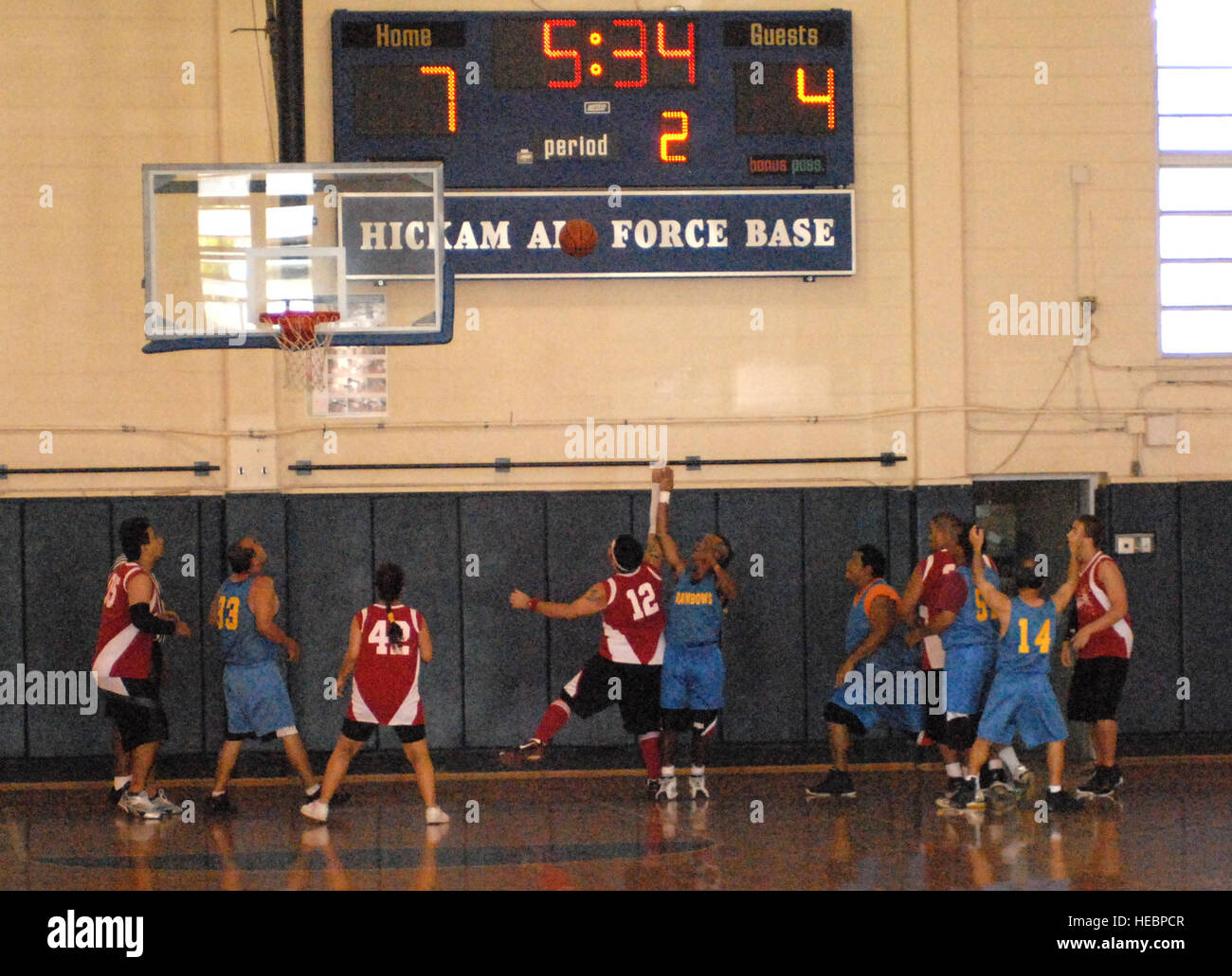 Athletes in the Special Olympics play basketball at the Hickam gym at ...