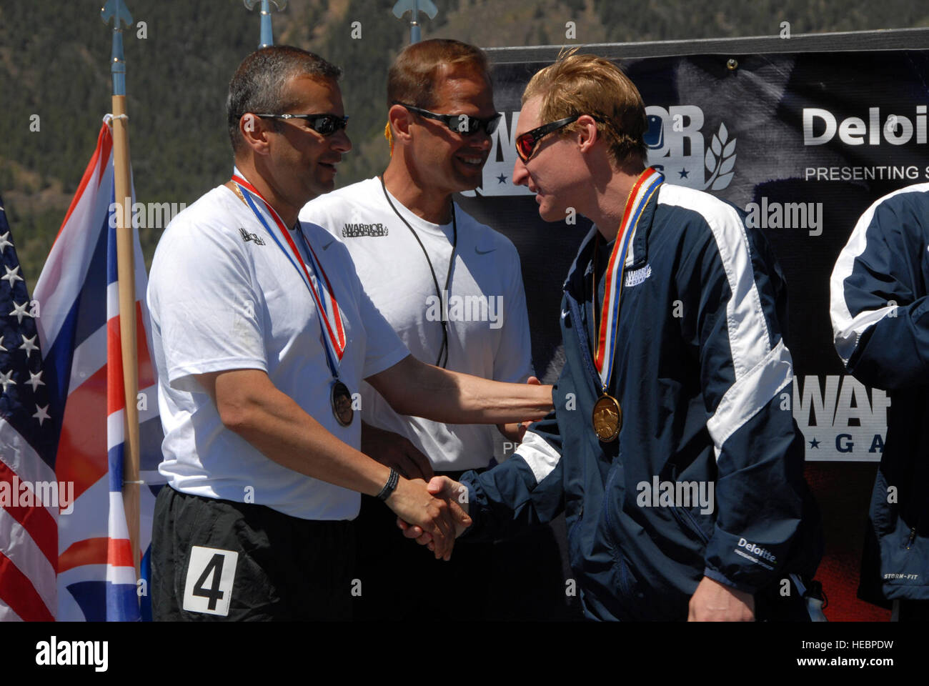 U.S. Army Capt. Ivan Castro (left) congratulates Navy/Coast Guard team ...