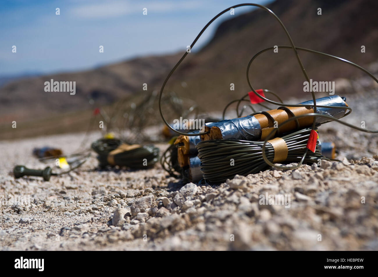 Sticks of dynamite are laid out at the 820th RED HORSE rock quarry ...