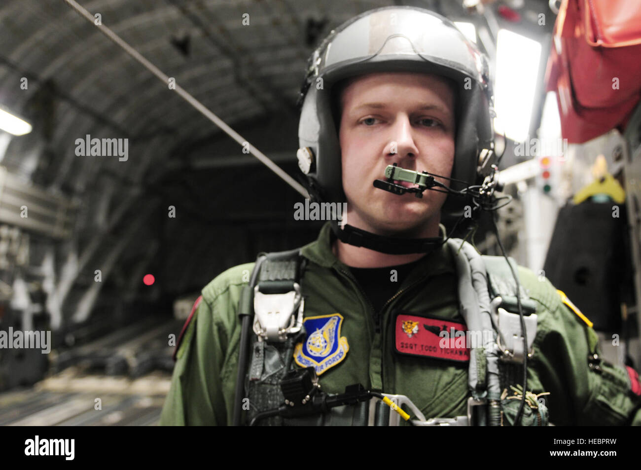 A C-17 Globemaster III loadmaster prepares bay doors for a high ...