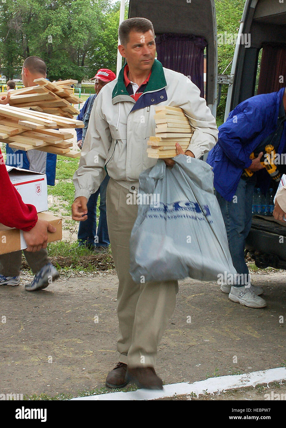 Col. Gerard Caron carries art supplies to the Manas Village School in ...