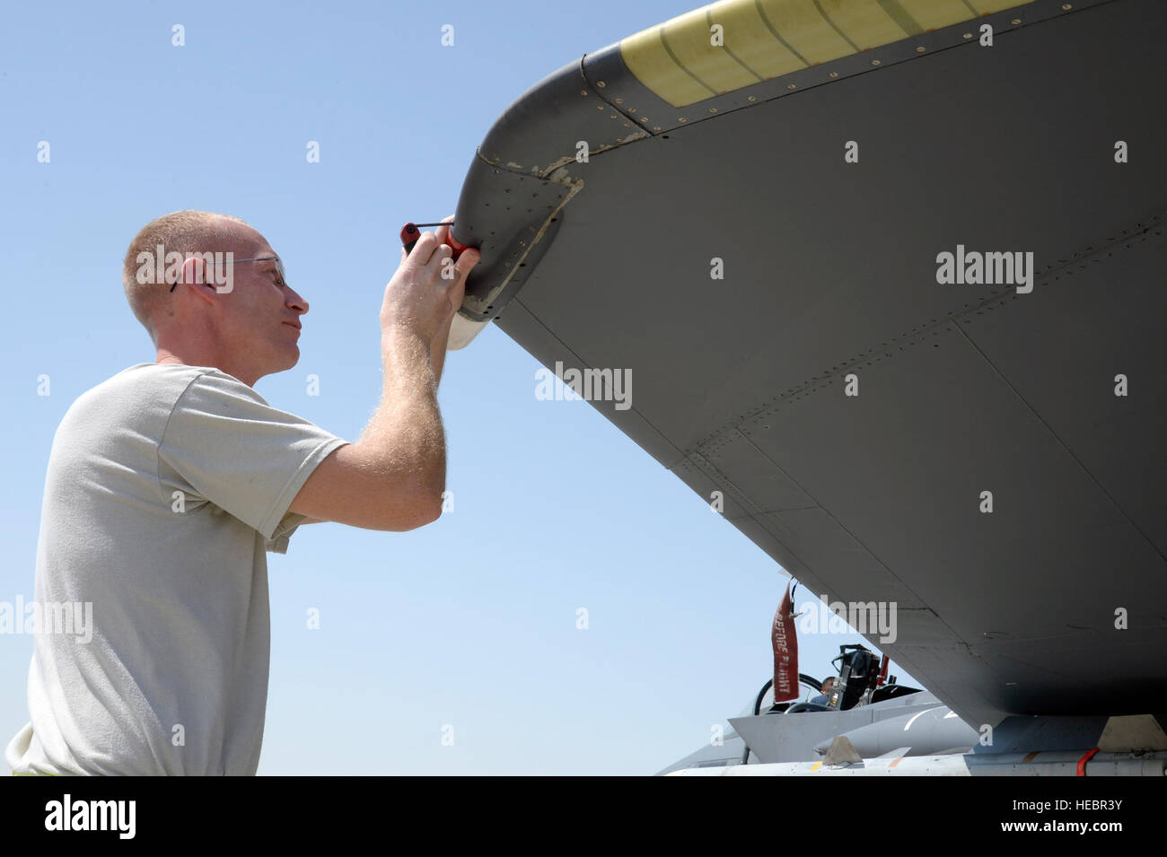 Tech. Sgt. Joshua, electrical and environmental craftsman, changes a ...