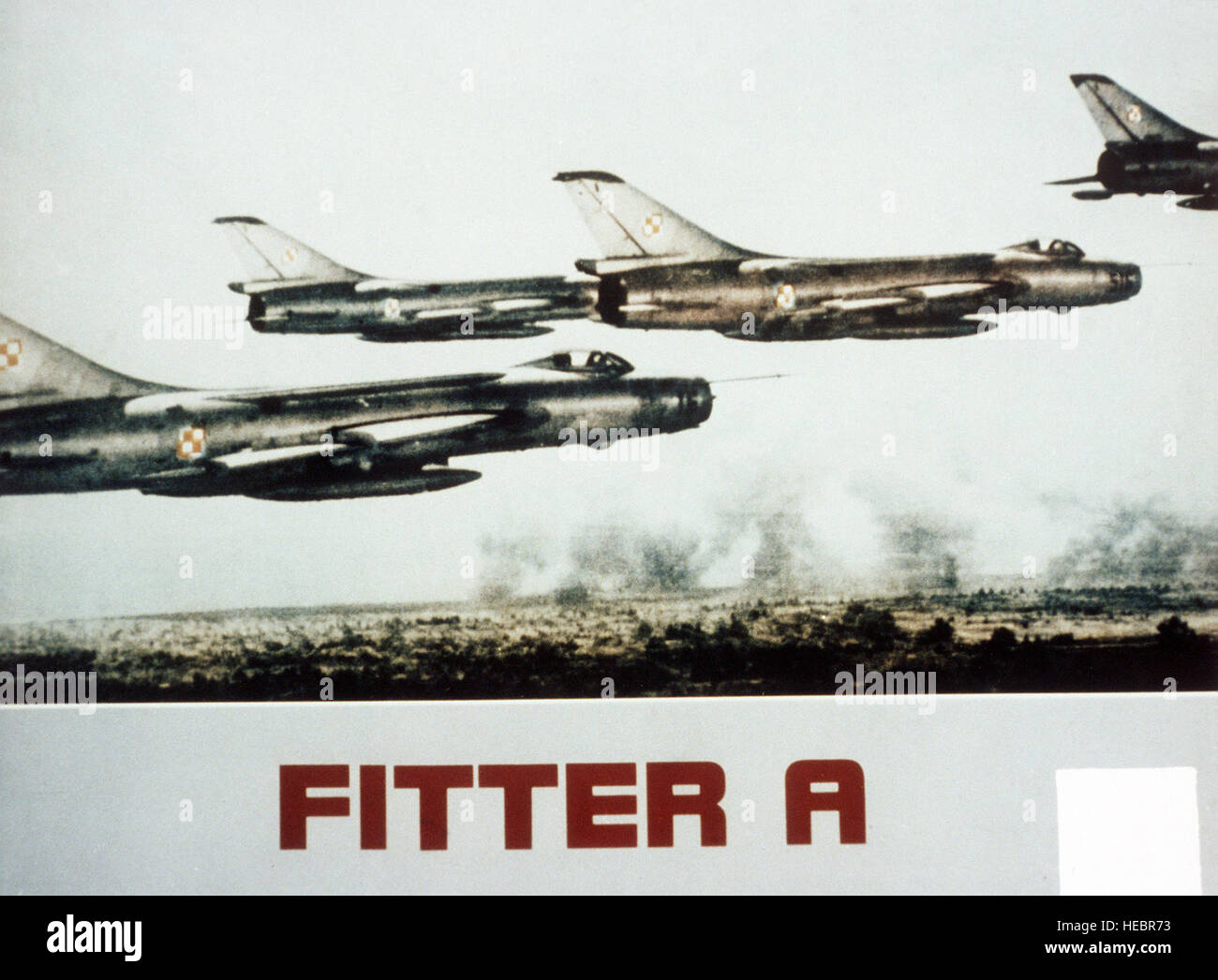 A right side view captures three Soviet Su-7 Fitter-A aircraft flying ...