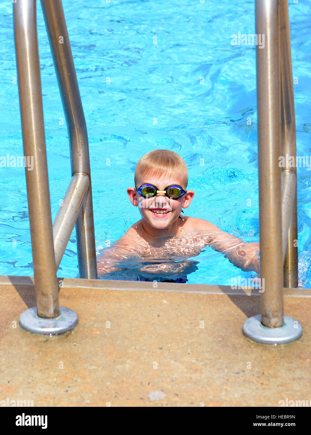 C.J. Kissell, 8, gets ready to climb out of the swimming pool at Robins ...