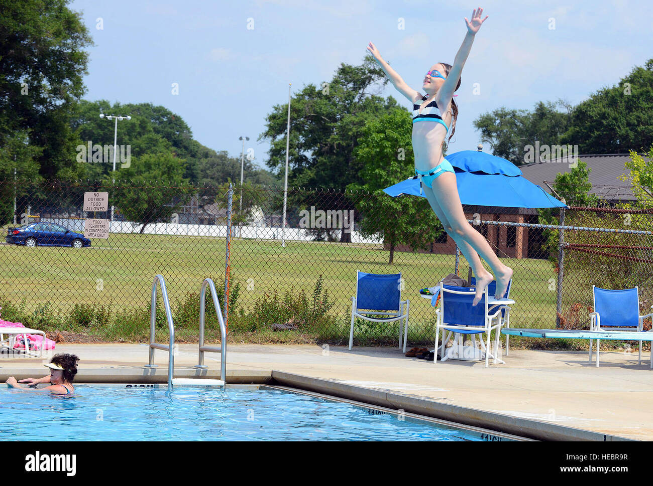 Grace Crumpton, 10, dives into the pool at Robins Air Force Base’s ...