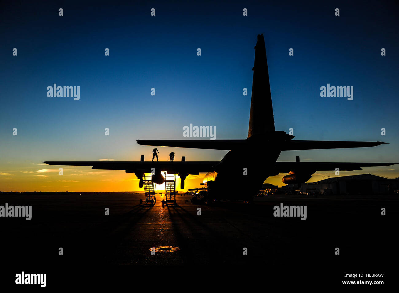 Airmen from the 1st Special Operations Aircraft Maintenance Squadron work on an AC-130U Spooky ...