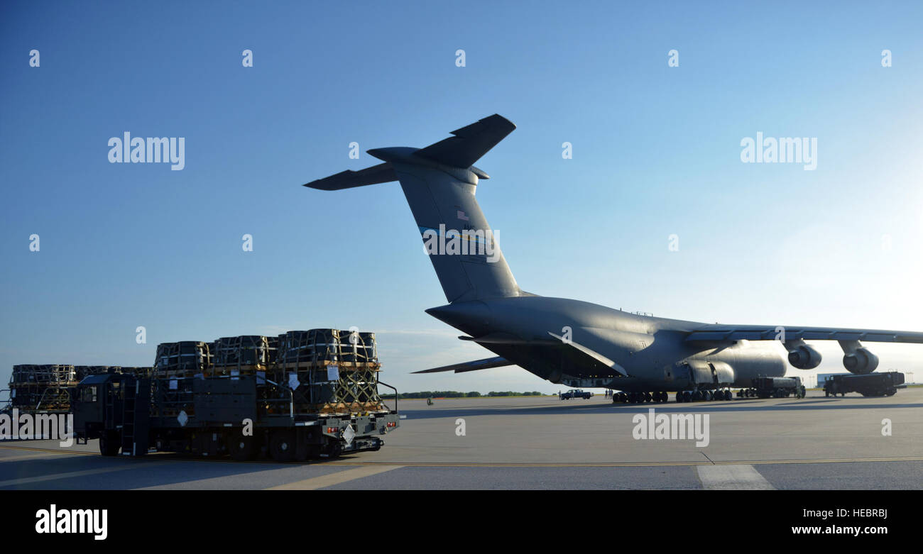 Cargo sits on the ramp behind a C-5M Super Galaxy from Dover Air Force ...