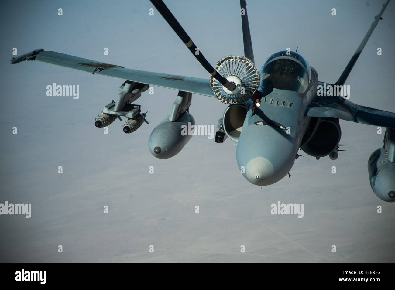 A Royal Australian Air Force F-18 Super Hornet receives fuel from a KC ...
