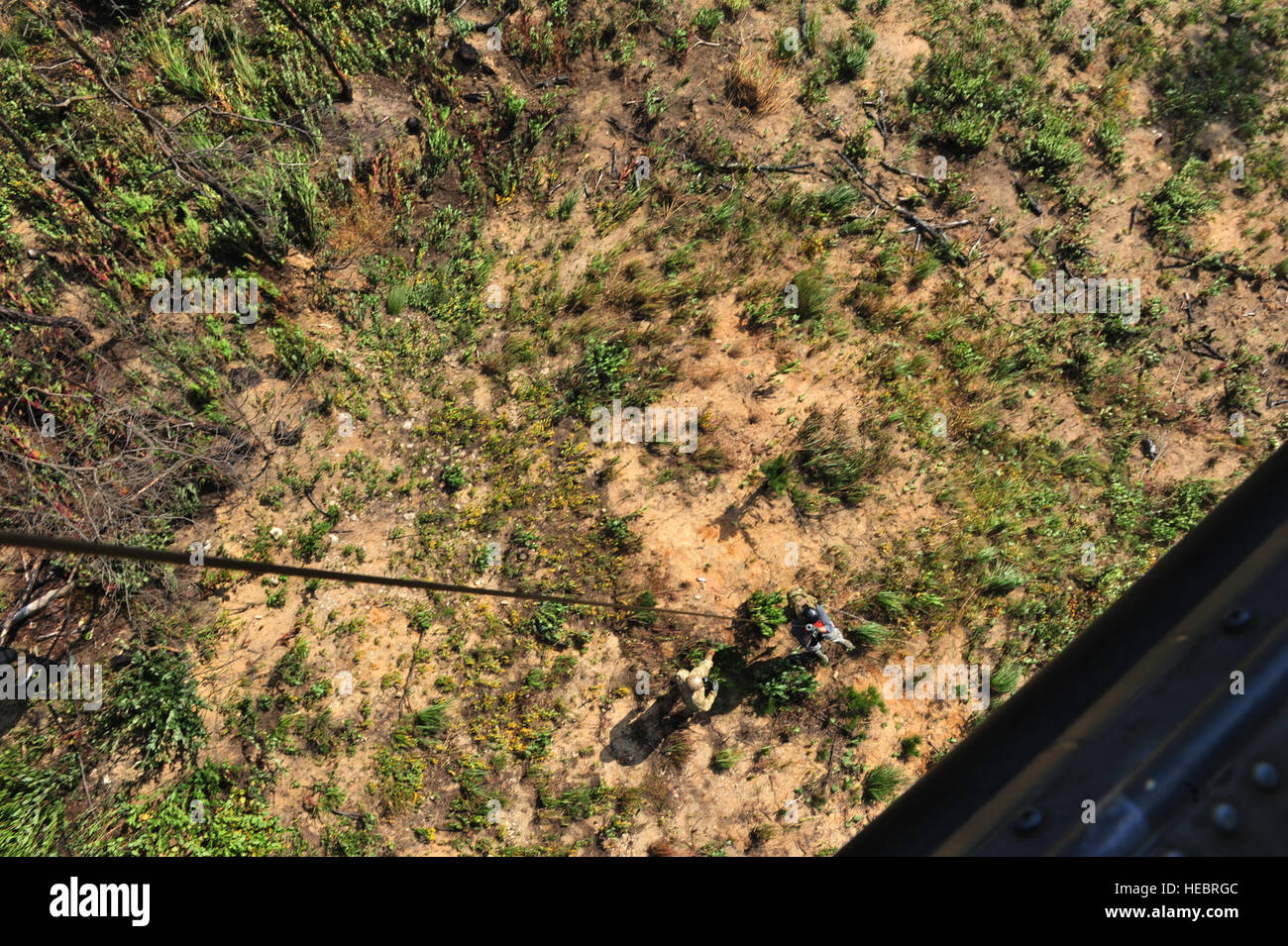A survival, escape, resistance and evasion specialist helps a simulated ...