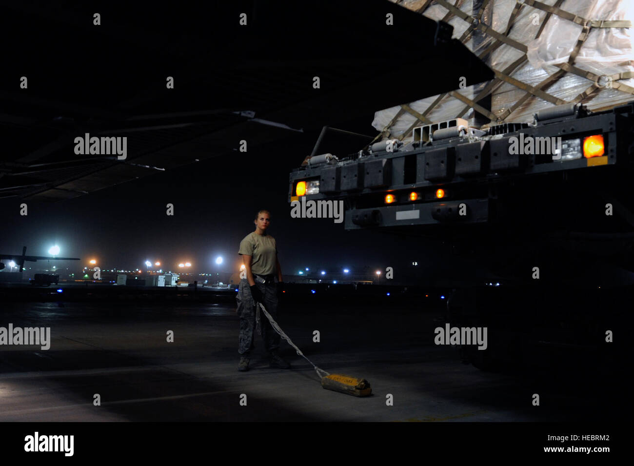 U.S. Air Force Airman 1st Class Mary Karls performs her ramp operations ...