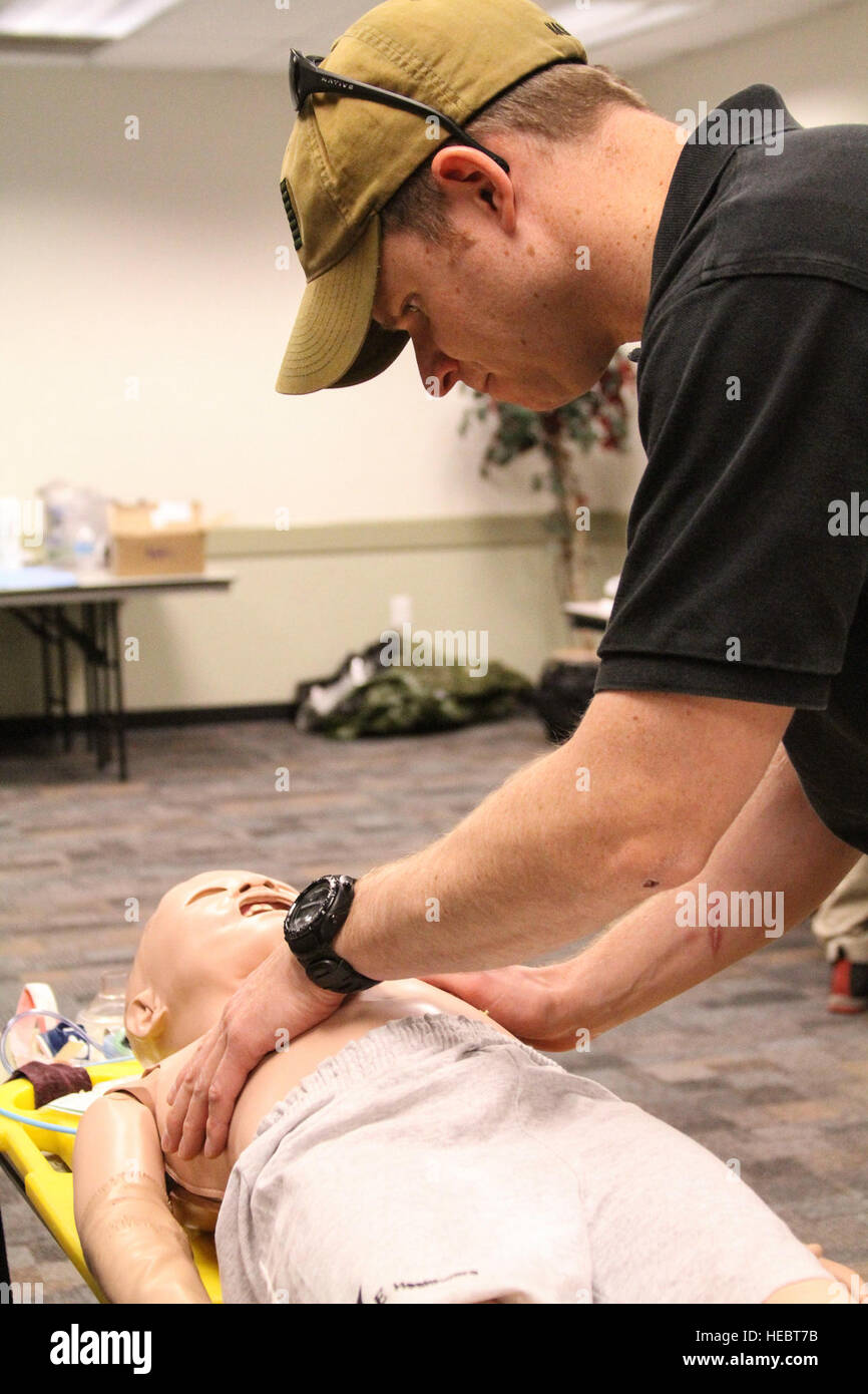Ryan Savage practices looking for signs of trauma on a dummy during ...