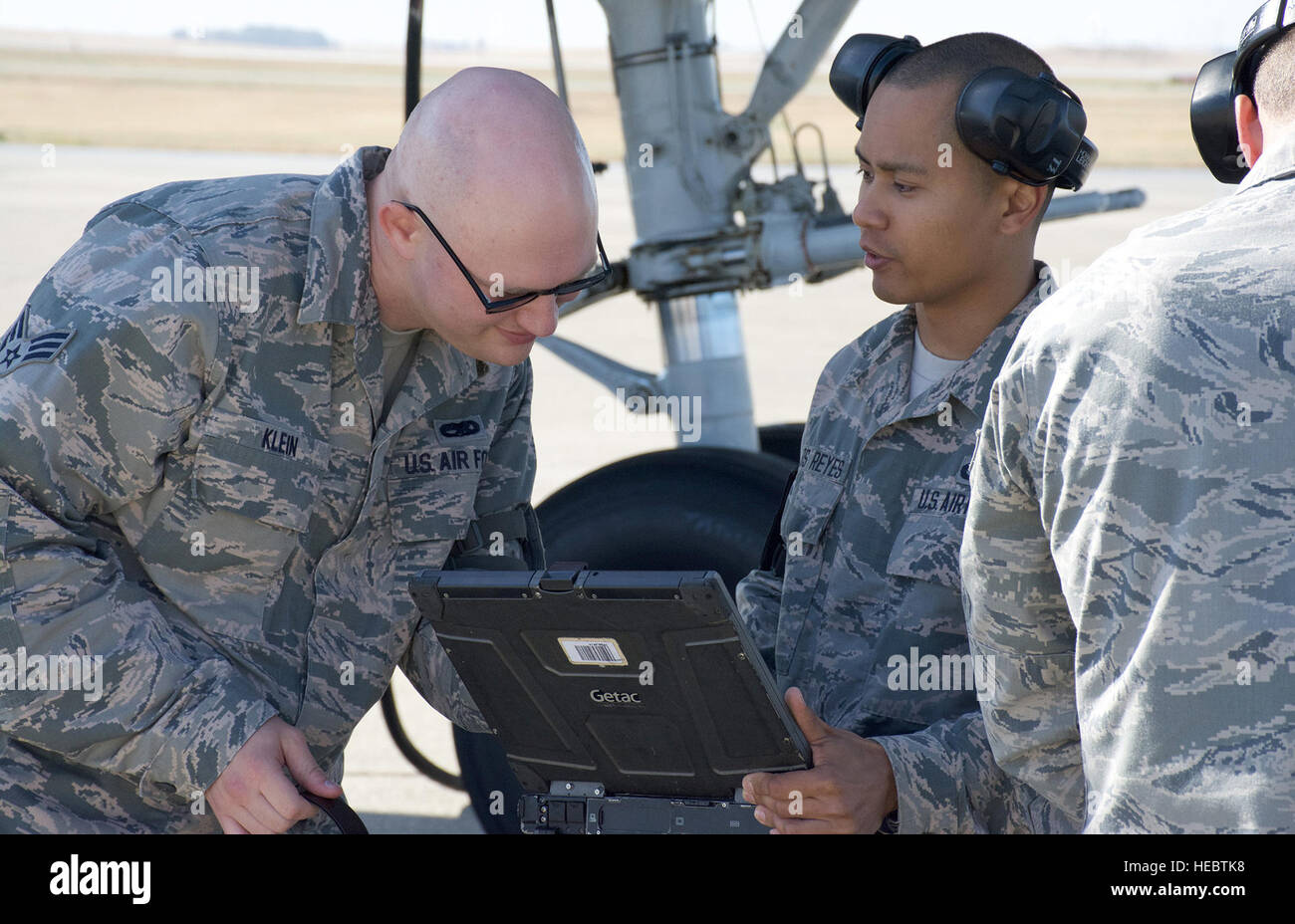 Senior Airmen Roger Klein and David Delos-Reyes review data on KC-10 ...