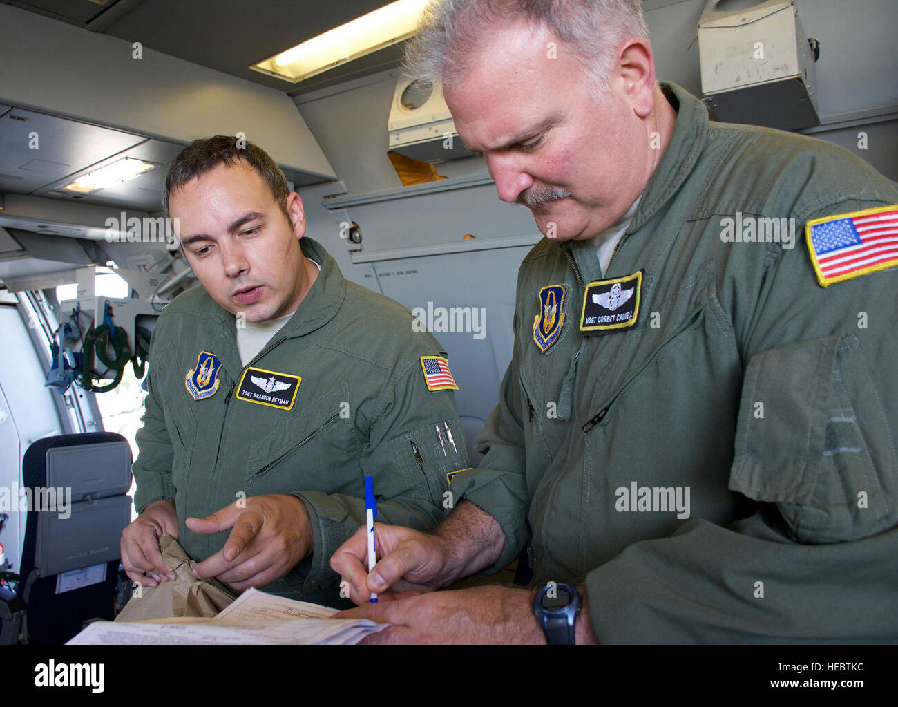 Tech. Sgt. Brandon Heyman (left) and Master Sgt. Corbet Cadwell sign ...