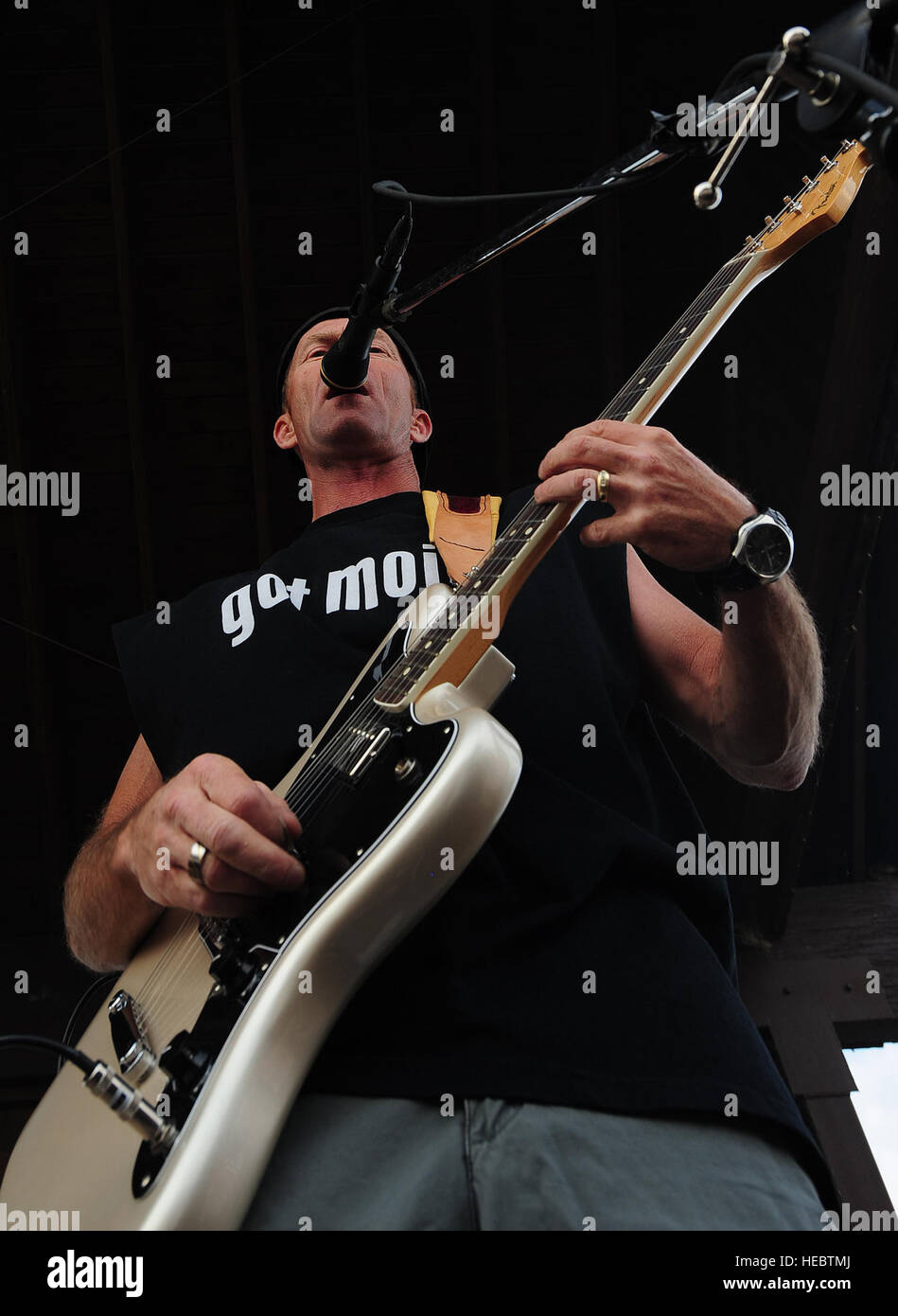 John Miller, lead singer of the Mojo Doggs, a local Rock band, sings to ...