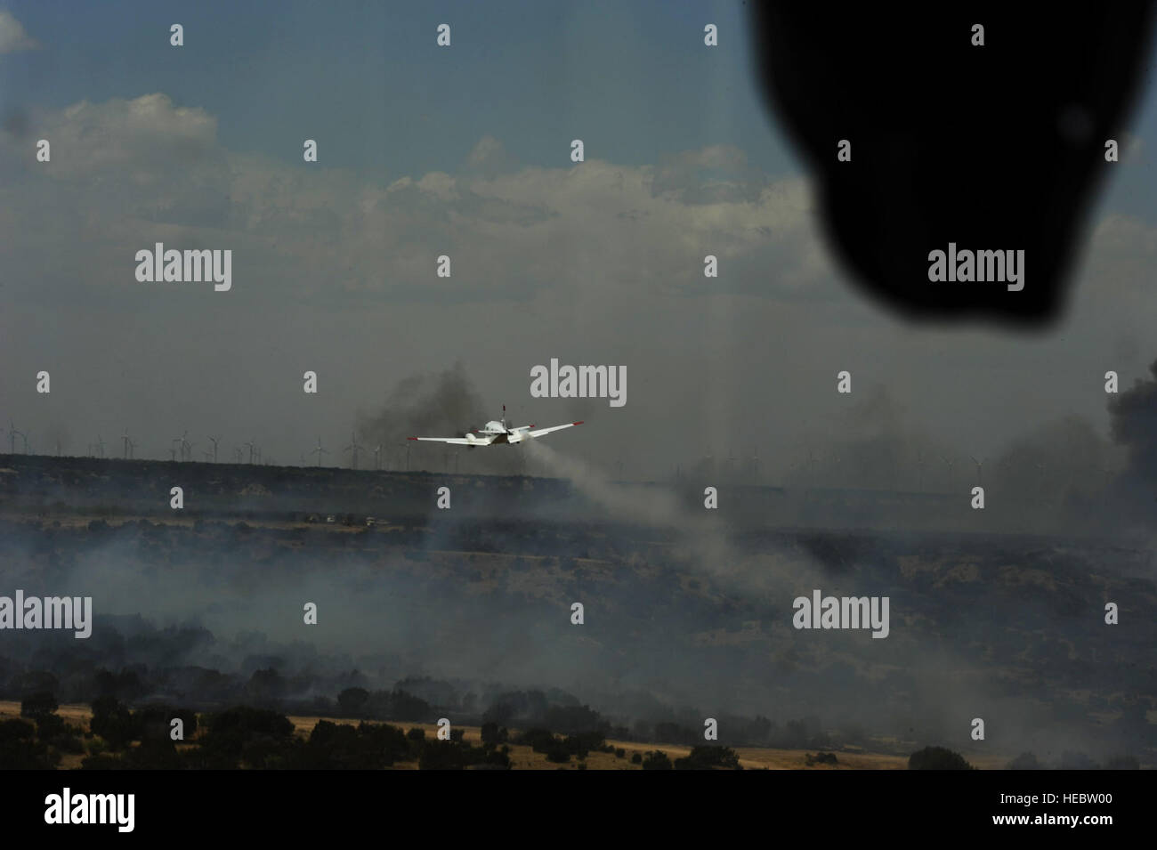 A King Air lead plane from the USDA Forest Service guides a C-130J ...
