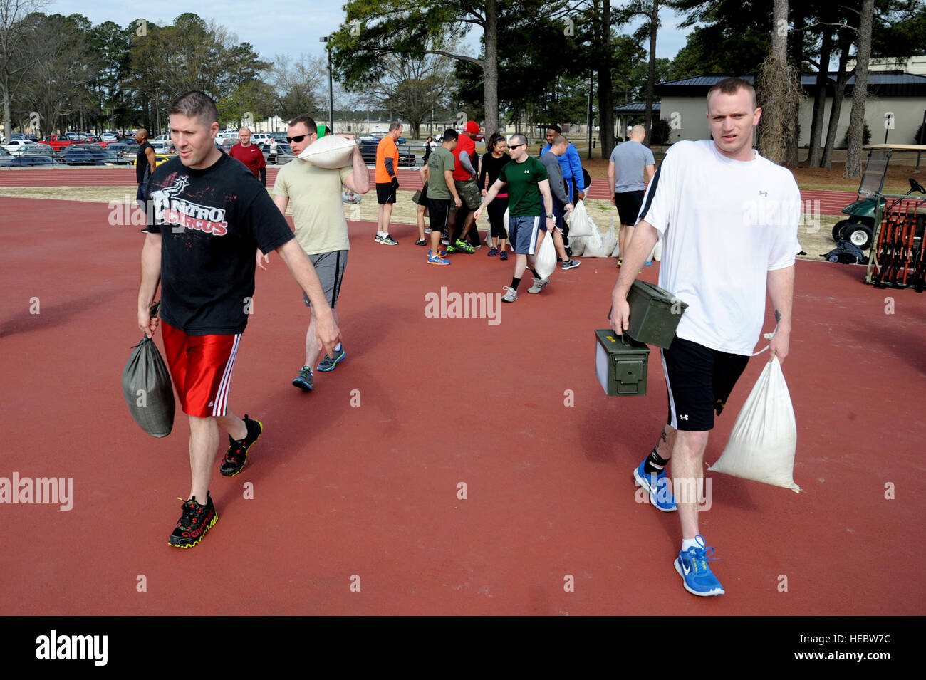 Combat Fitness Challenge participants help setup obstacles before ...