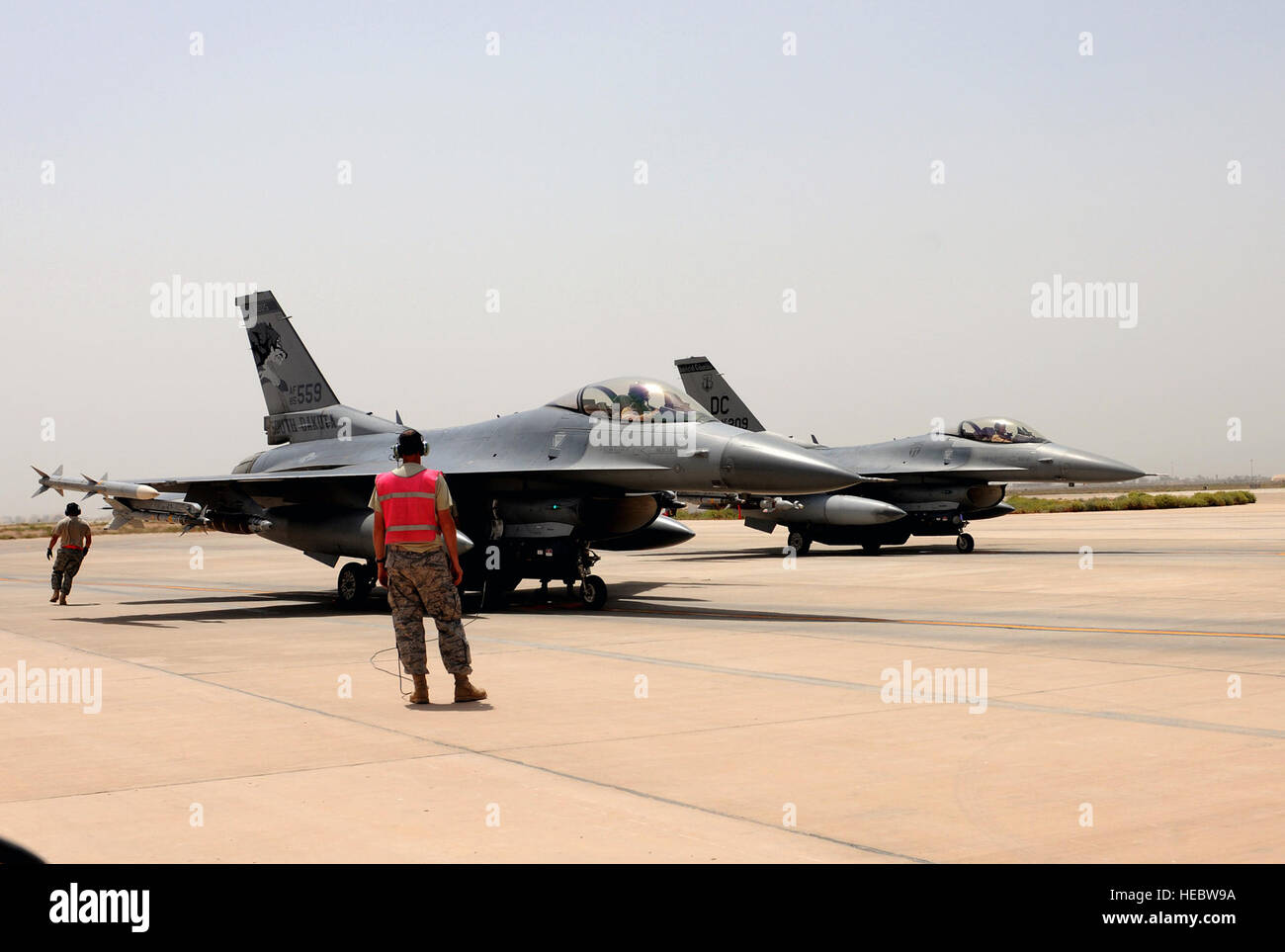 Pilots with the 332nd Expeditionary Fighter Squadron stand by while ...