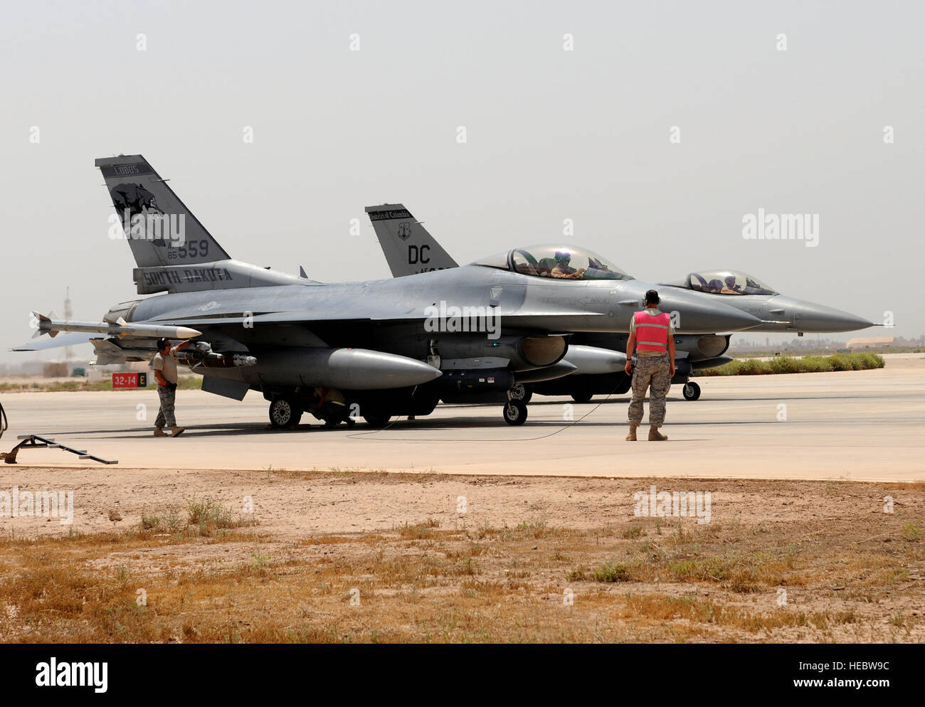 Pilots with the 332nd Expeditionary Fighter Squadron stand by while ...