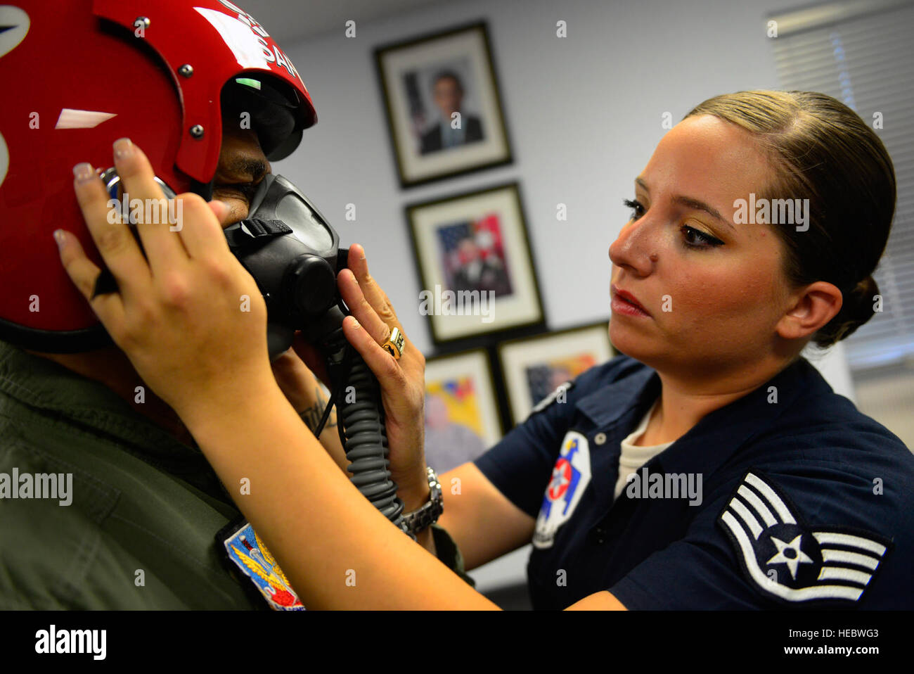 A U.S. Air Force aircrew flight equipment specialist prepares a flight ...