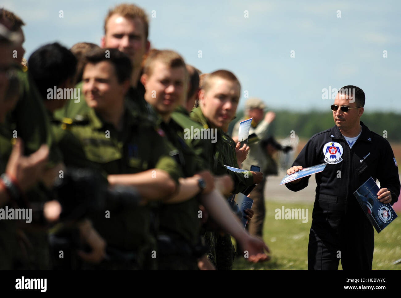 Staff Sgt. Jacob Richmond, NCOIC, community relations, hand out ...