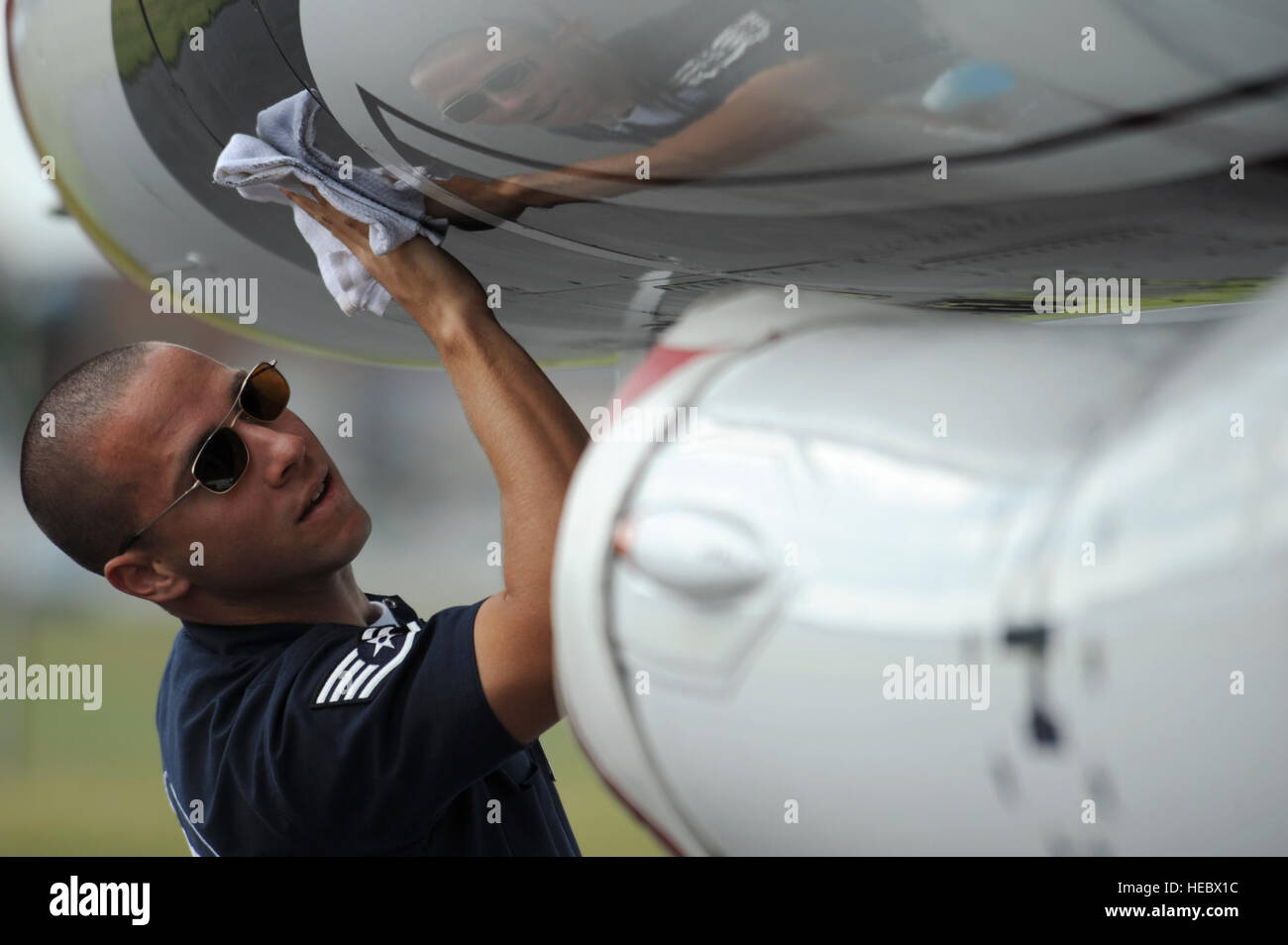 Staff Sgt. Luke Miller, a Thunderbird crew chief, wipes down his jet ...