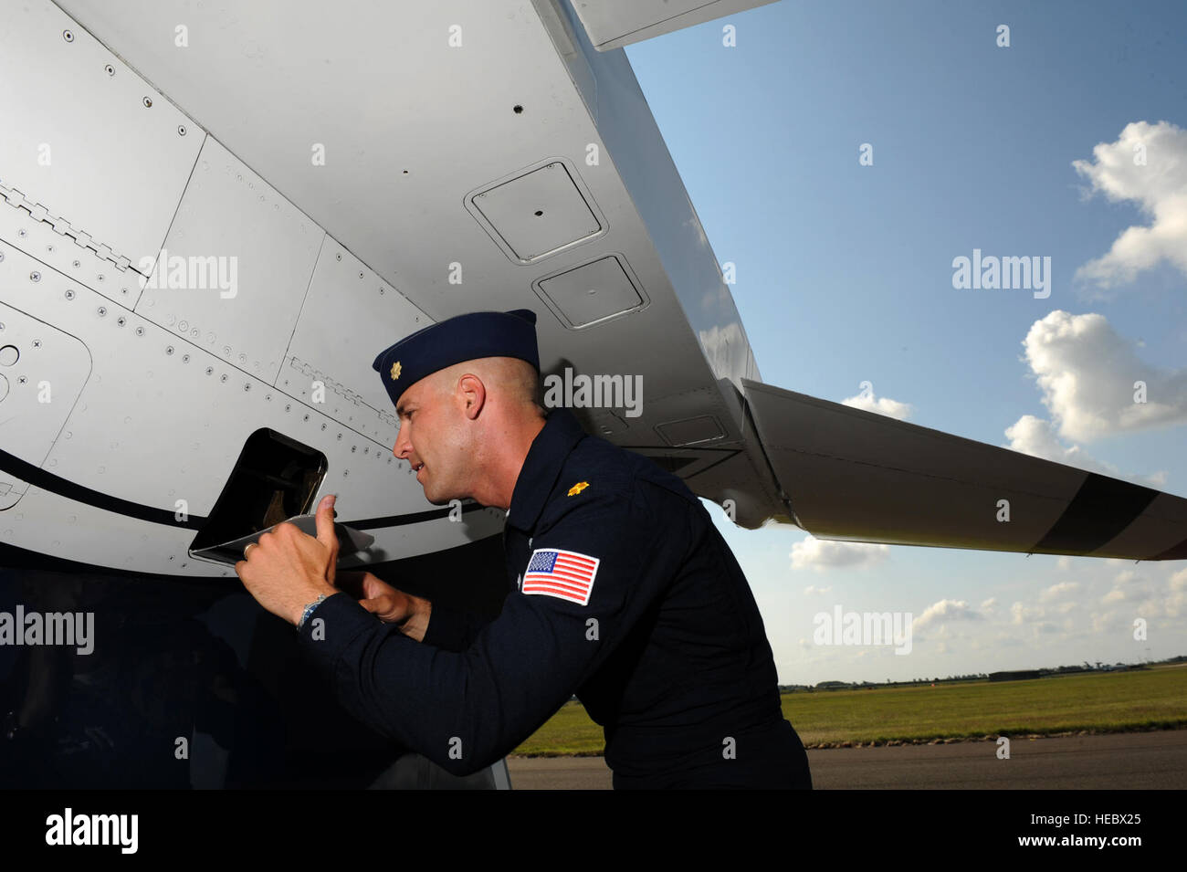 Maj. Jason Moore, Thunderbird 11, Maintenance Officer, inspects a panel ...