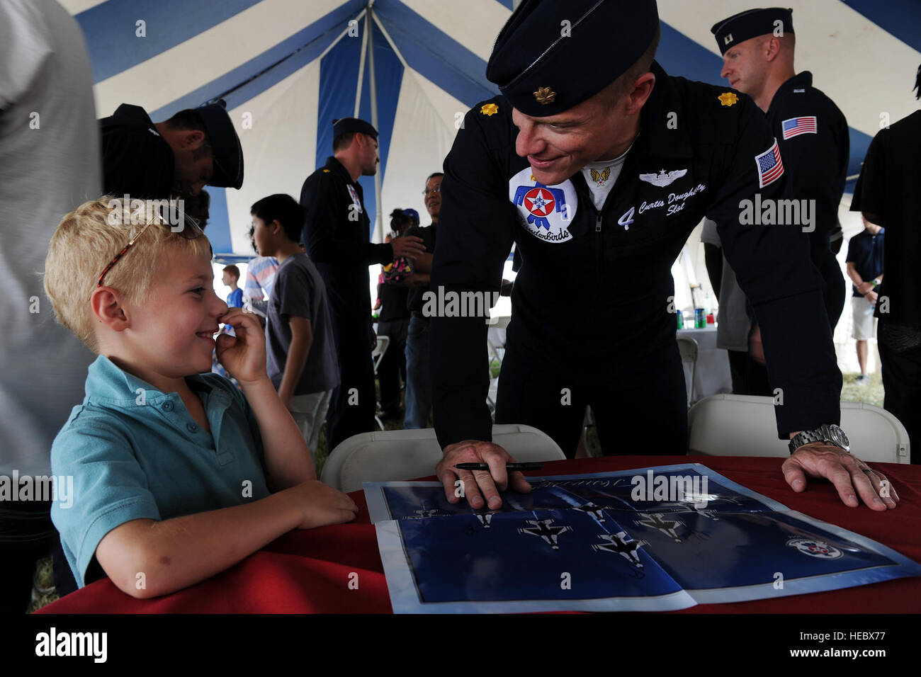 Maj. Curtis Dougherty, Thunderbird 4, slot pilot, interacts with a ...