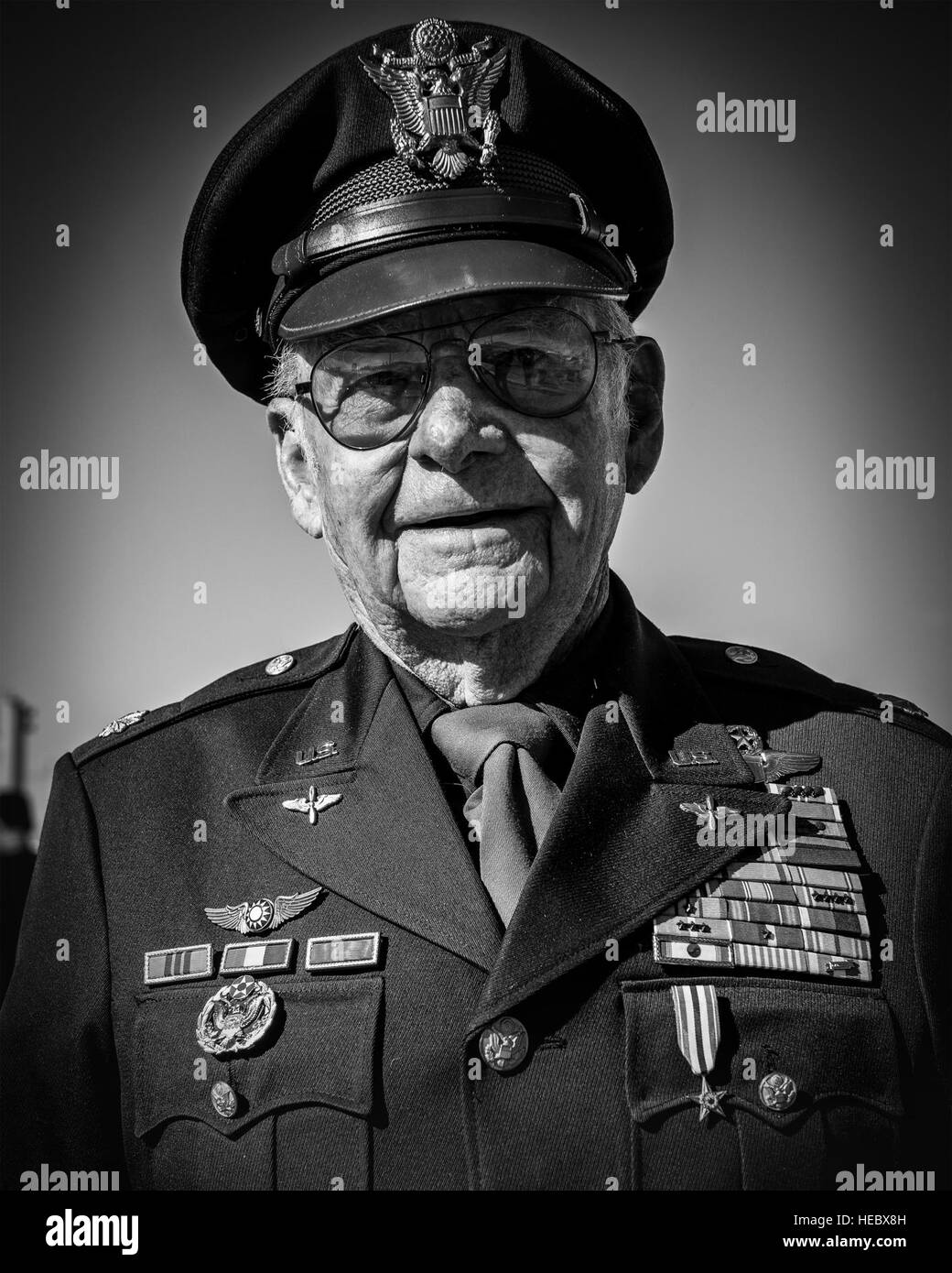 A retired service member shows his pride in his old uniform during the ...