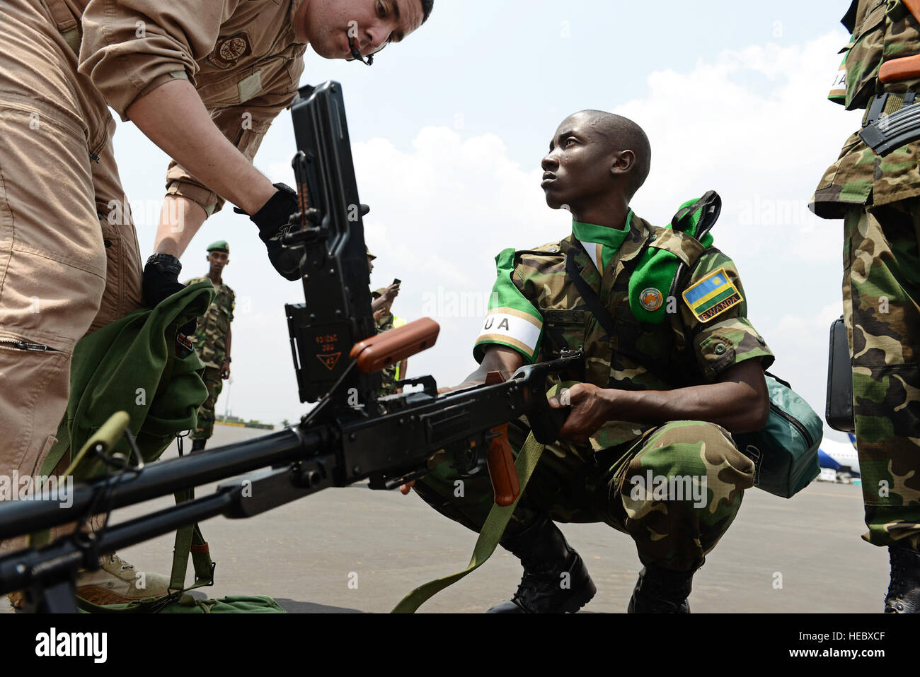 A Rwandan soldier, right, looks to U.S. Air Force Senior Airman Chase ...