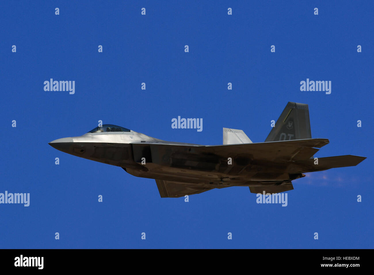 A U.S. Air Force F-22 Raptor performs an aerial demonstration during ...