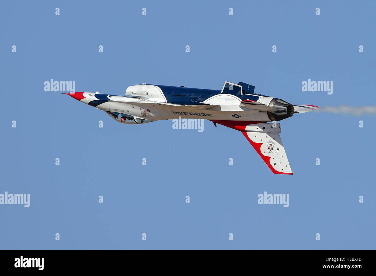 U.S. Air Force Thunderbird 6 pilot performs an inverted flight in an F ...