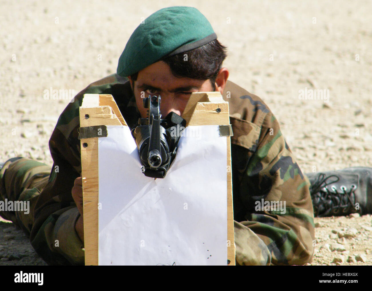 A 203rd Corps Afghan National Army soldier lines up his sights on a ...