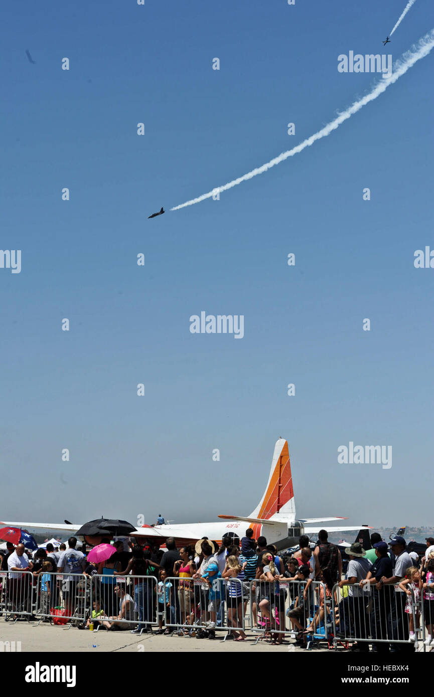 Spectators watch aerial demonstrations from various aircrafts during ...