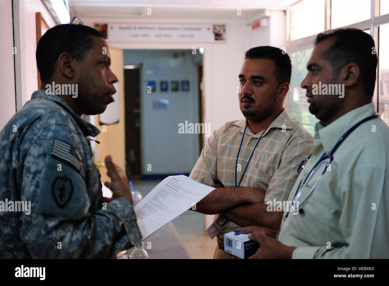 Steve, an interpreter for the U.S. Army, briefs Aala Housein Hamad and ...