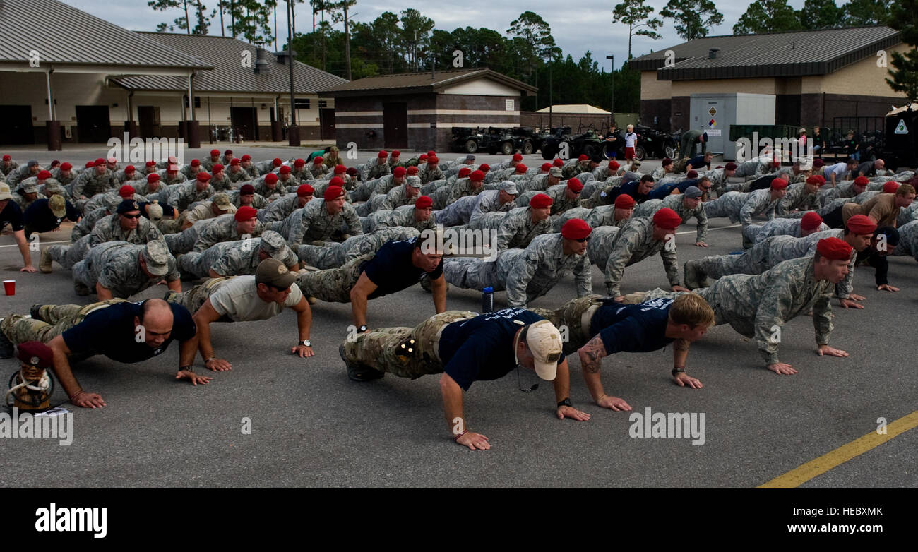 U.S. Air Force Airmen participate in memorial pushups during the Tim ...