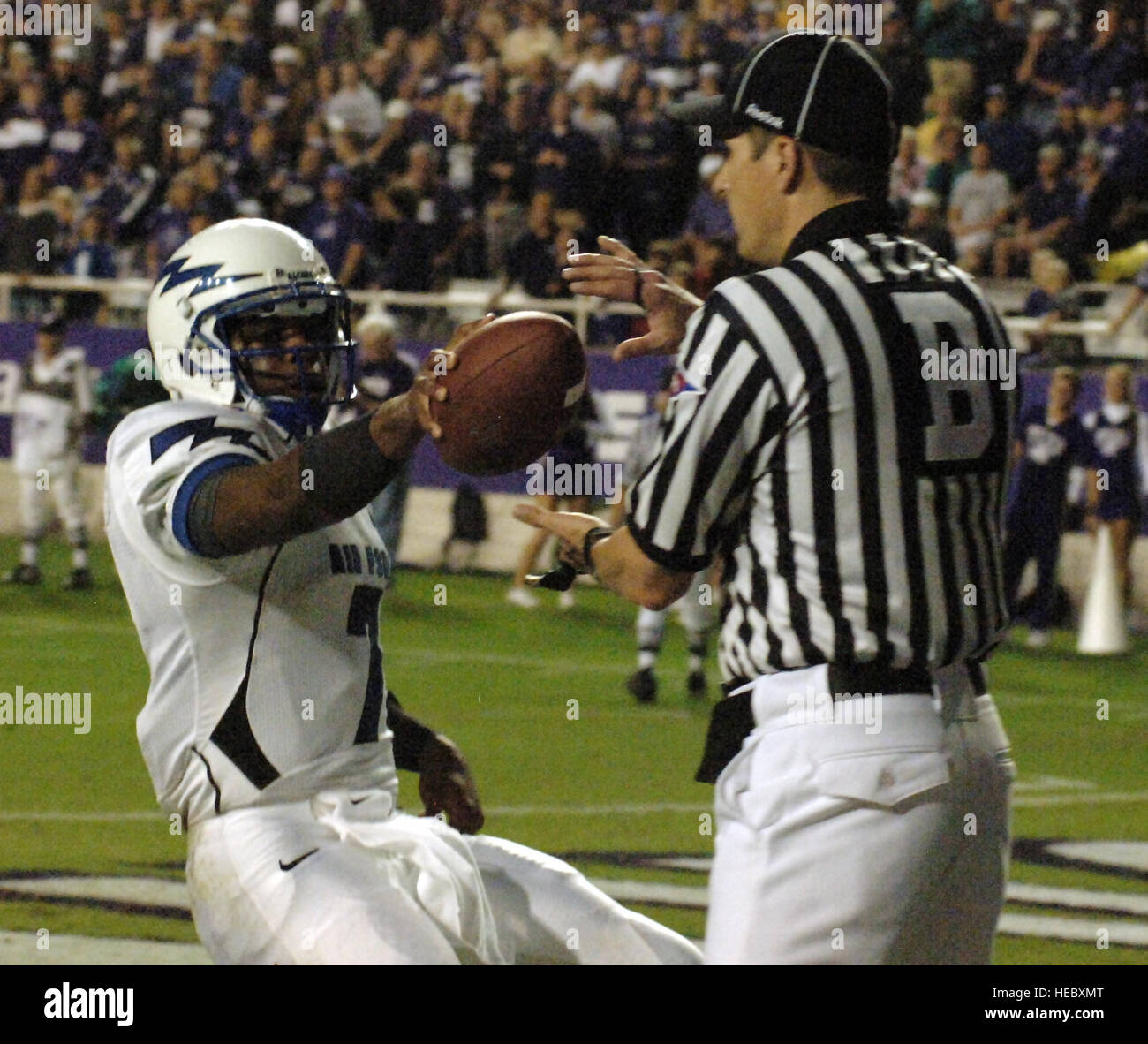 Air Force quarterback Tim Jefferson delivers the football to back judge ...