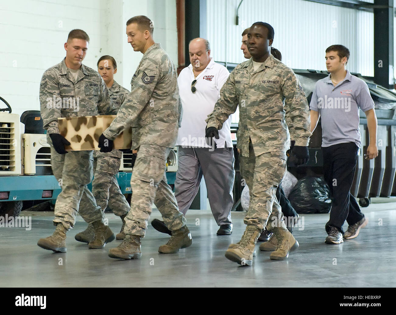 Members of the 436th Aerial Port Squadron and the “Cake Boss” cast ...
