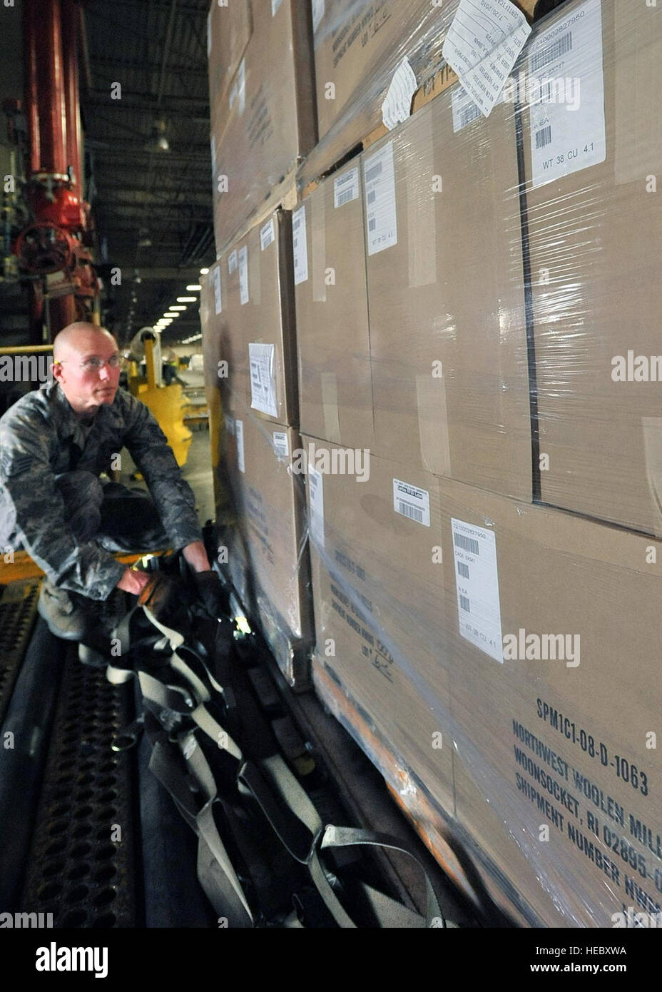 Air Force personnel from the 45th Aerial Port Squadron prepare a pallet ...