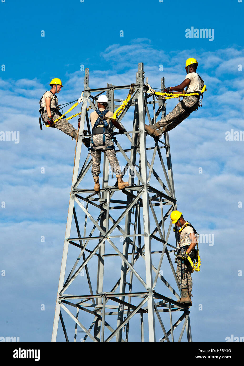 Airmen climb to the top of the outside of the tower and descend on the ...