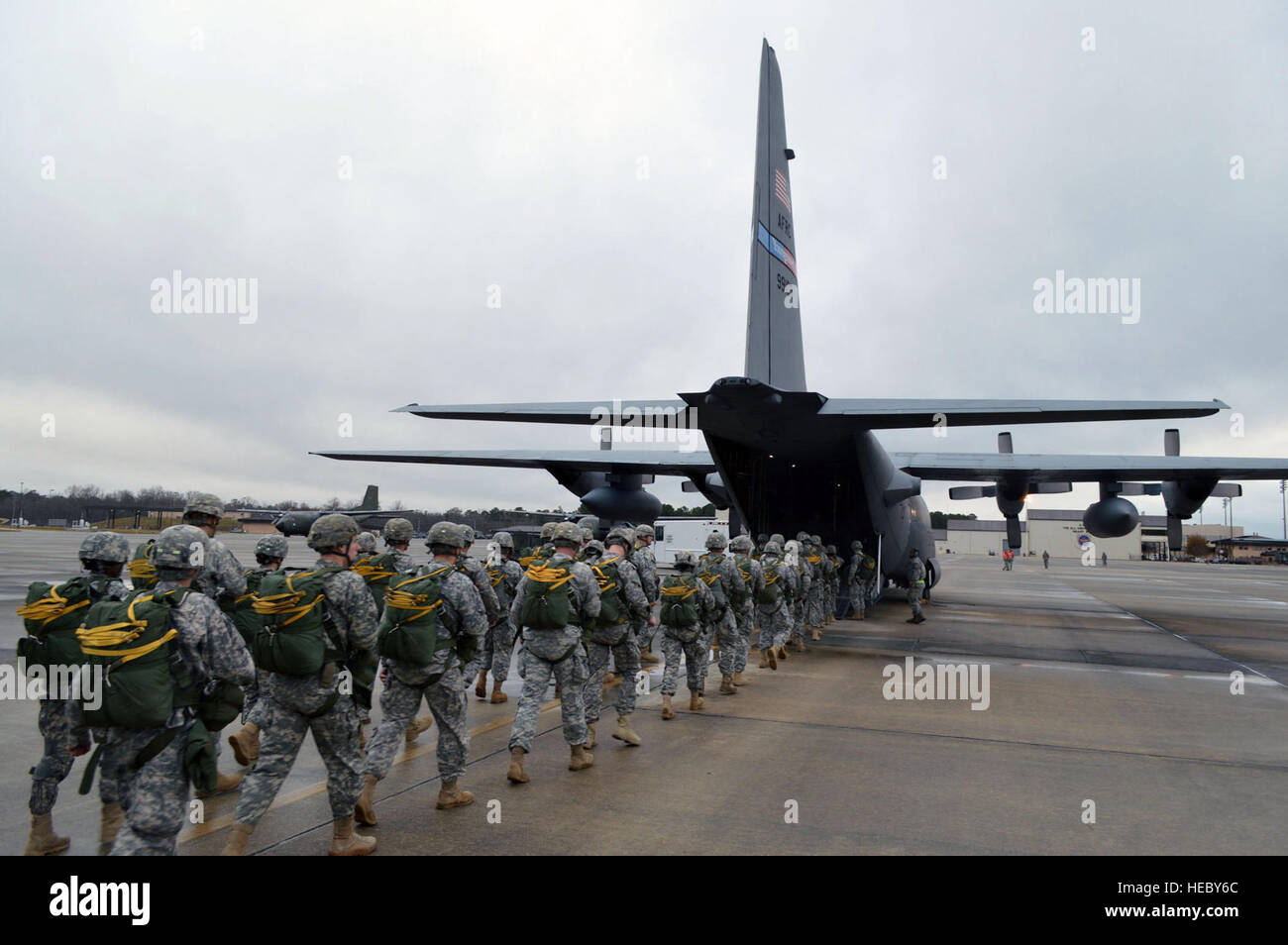 U.S. Army paratroopers from Fort Bragg, N.C. load onto a C-130H ...