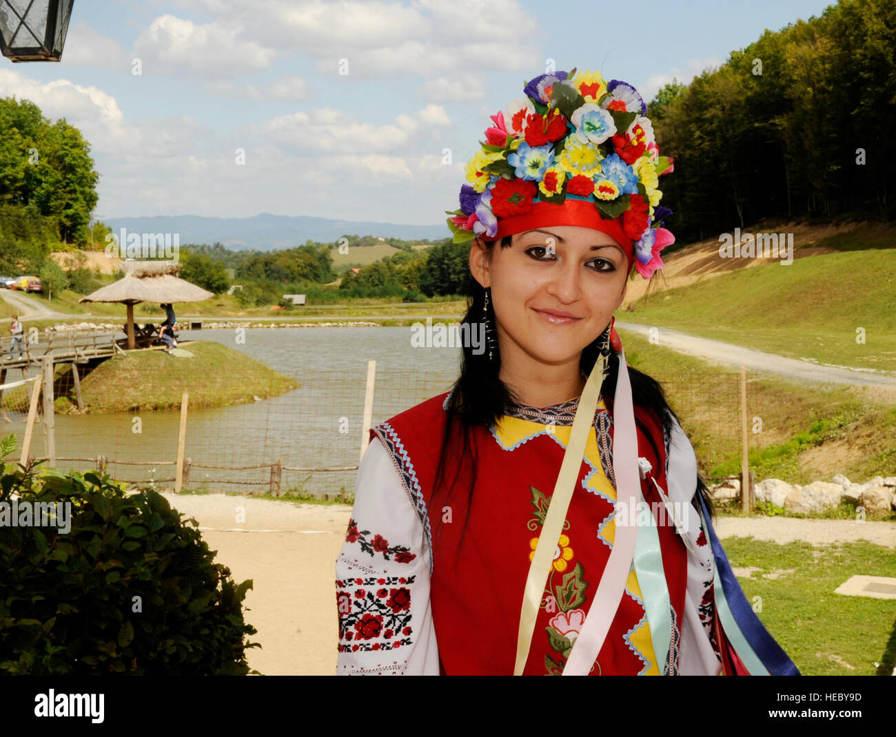 A vendor, dressed in traditional Bosnian clothing, attends the Combined ...