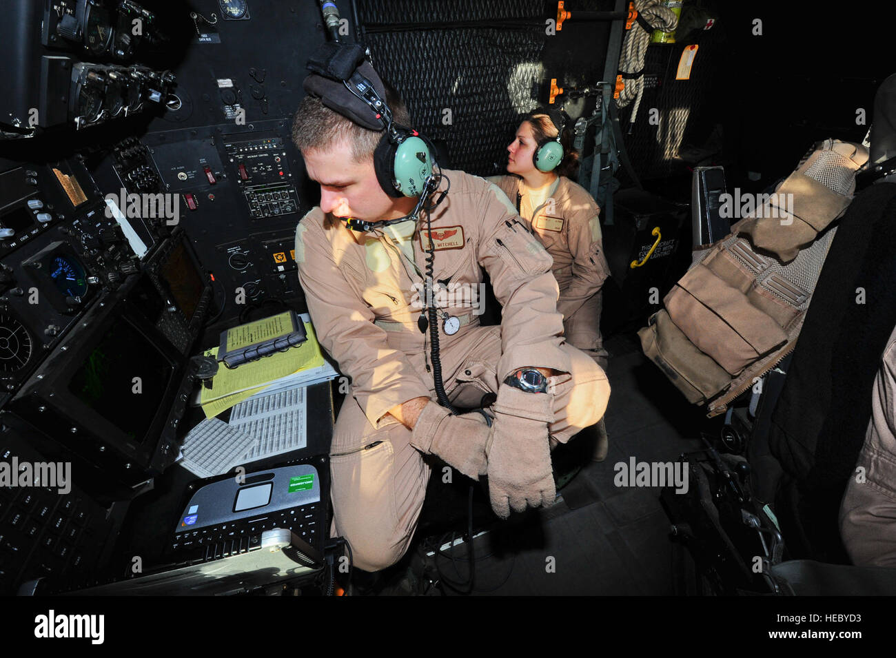 U.S. Air Force Capt. Jeff Mitchell, navigator, (left) and Airman 1st ...