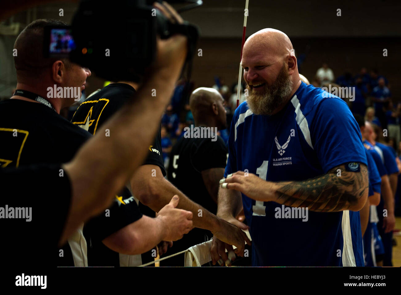 Retired U.S. Air Force Tech. Sgt. Keith Sekora, right, shakes hands ...