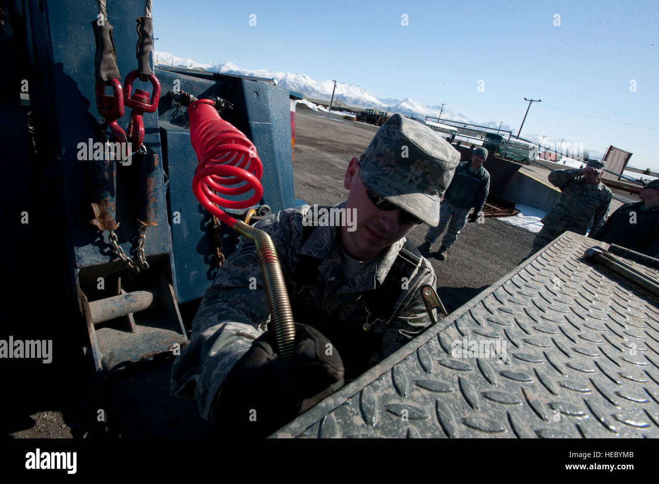 Airman 1st Class Robert Eddy secures connectors on a 15-ton wrecker on ...