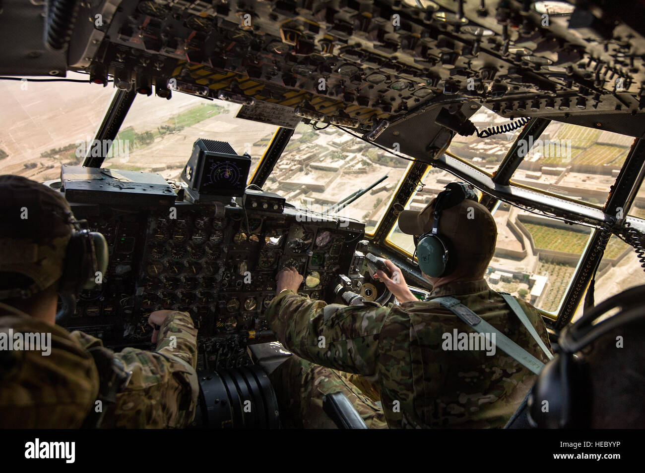 First Lt. Brent Stevens assisted by Maj. Devin Cummings, 774th ...