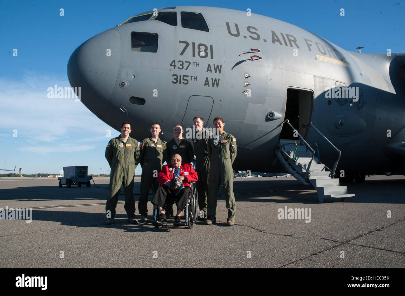 Tuskegee Airman Lt. Col. Hiram Mann poses with Airmen outside a C-17 ...