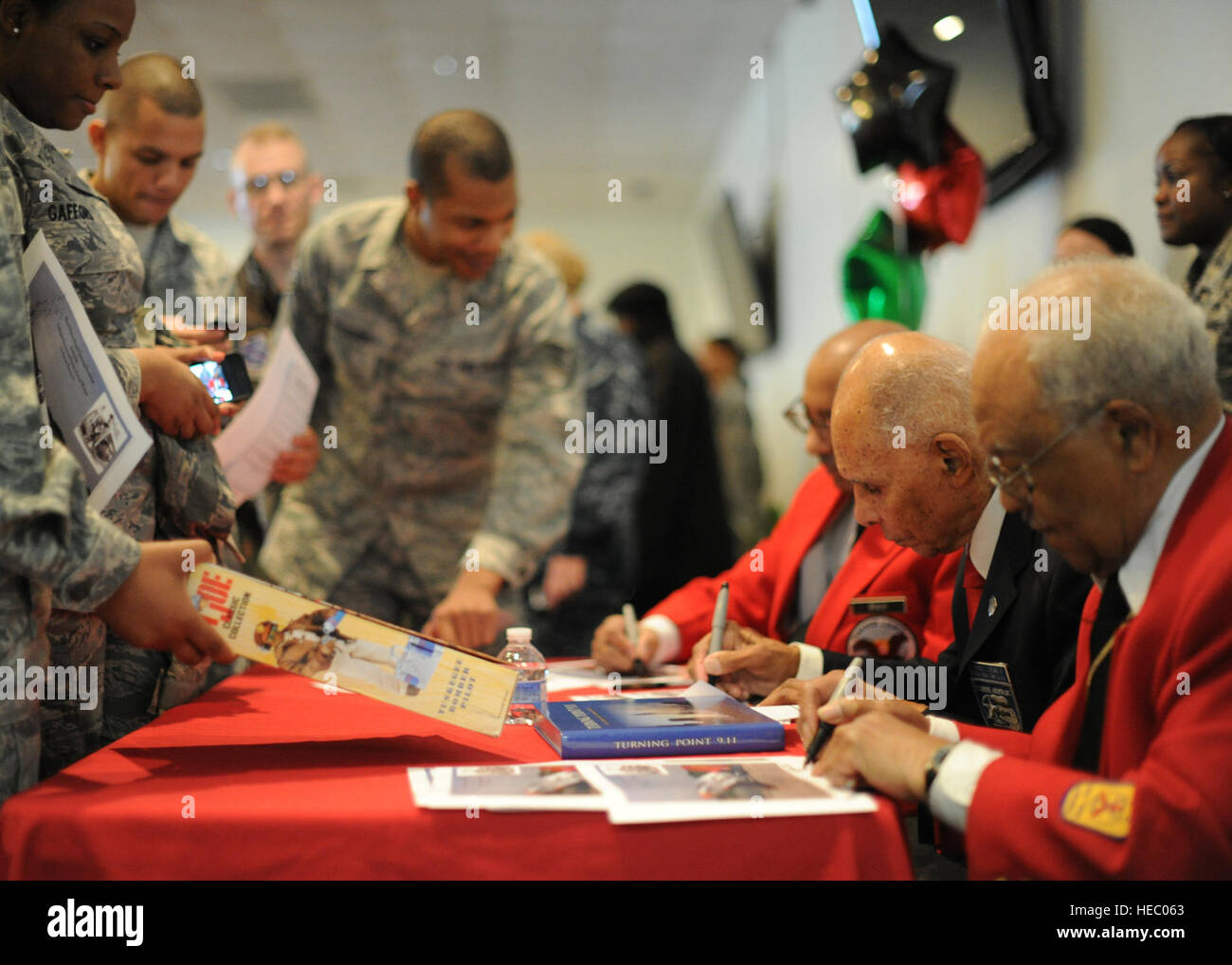 Tuskegee Airmen sign autographs for service members during the Black ...