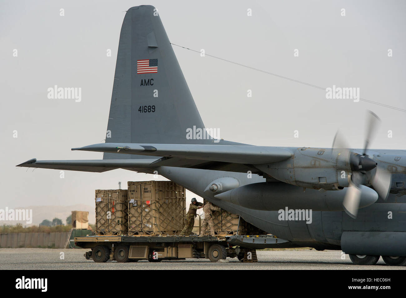 A loadmaster from the 774th Expeditionary Air Lift Squadron and aerial ...