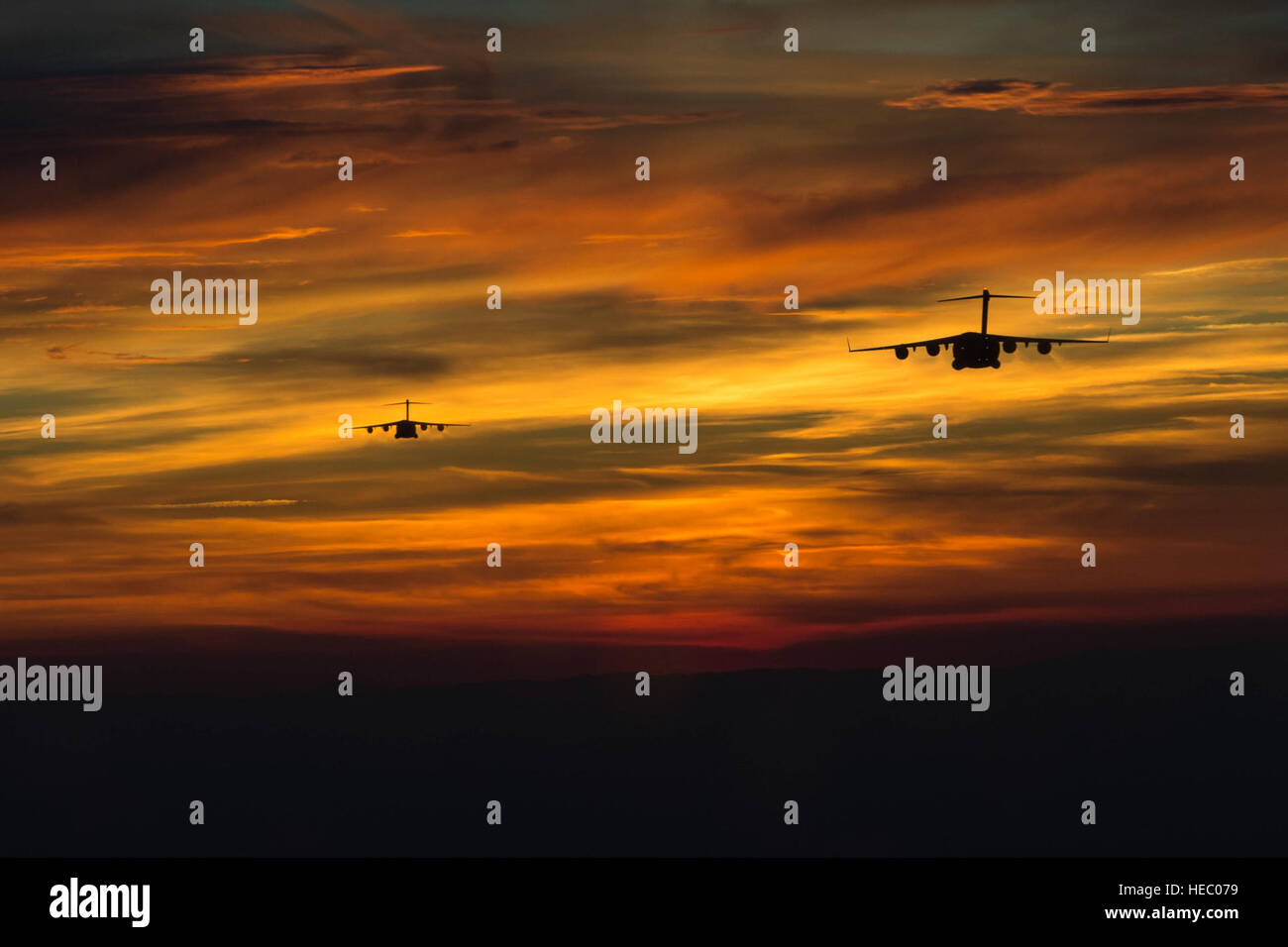 Two C-17 Globemaster III aircraft from the 437th Airlift Wing conduct a ...