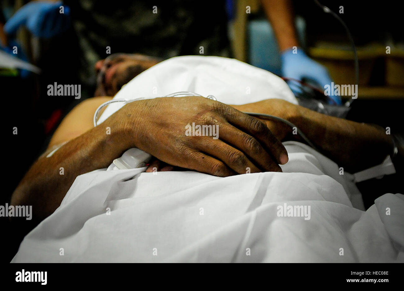 An Afghan victim of an improvised explosive device receives treatment ...
